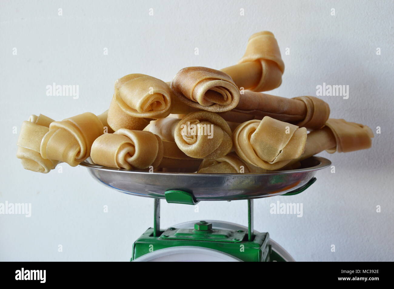 dog bone on weighing scale for sale Stock Photo - Alamy