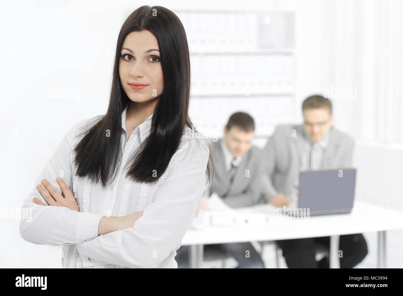 portrait of a woman Manager on the background of the office Stock Photo ...