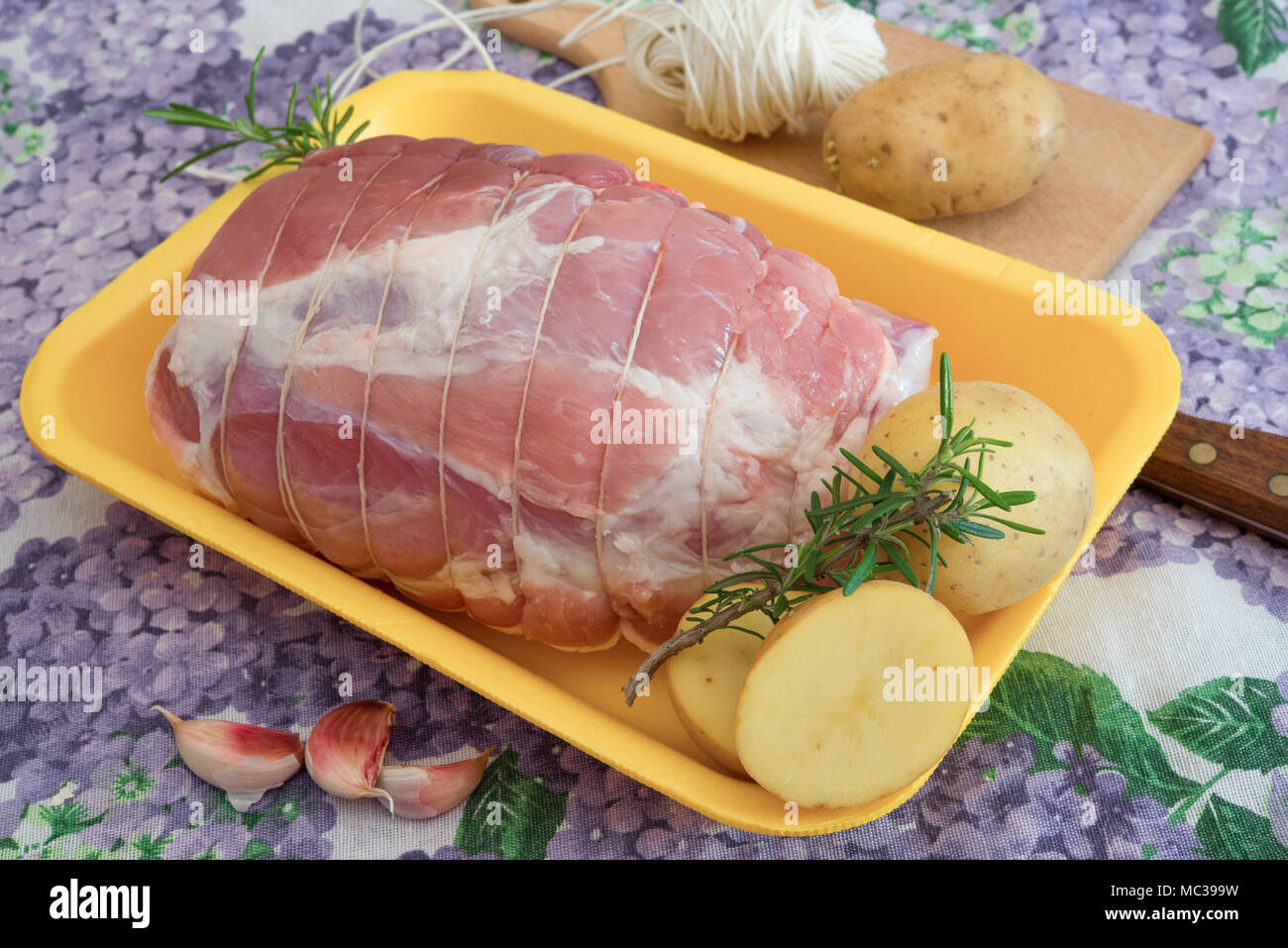 raw olled pork stuffed with bacon and tied with string Stock Photo - Alamy