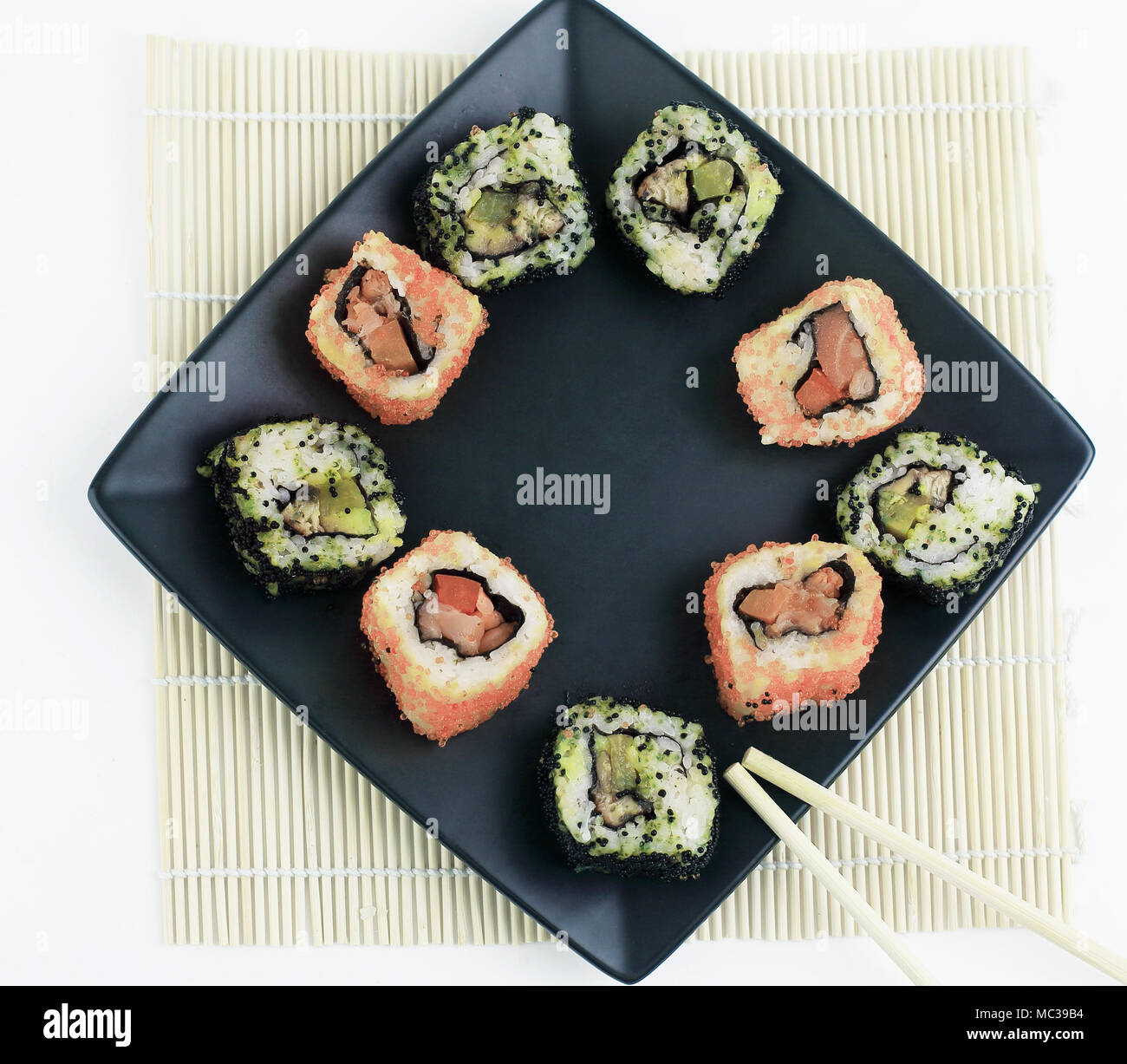 different types of Maki sushi on a black plate Stock Photo - Alamy