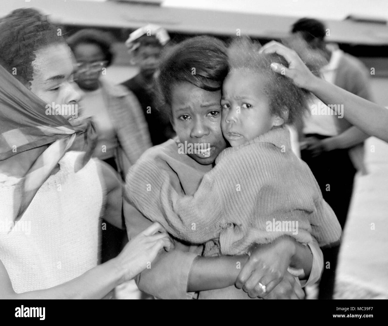 African American mother and child appear traumatized at an accident ...