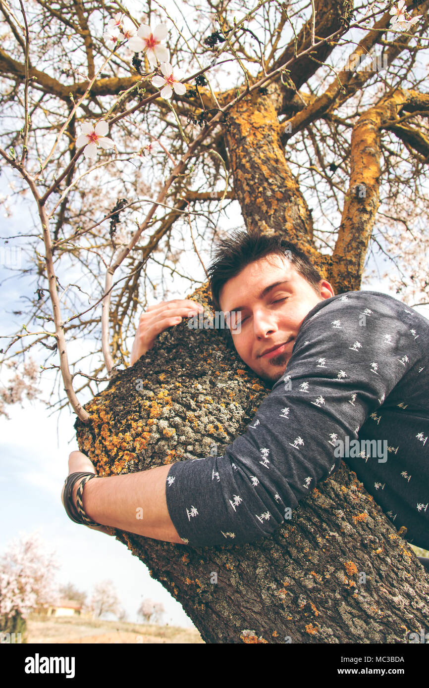 Man hugging tree funny hi-res stock photography and images - Alamy