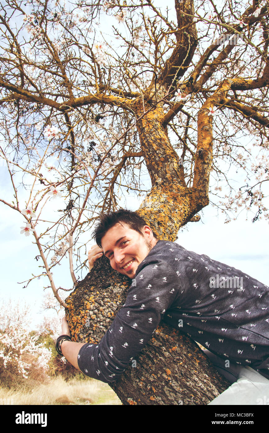 Man hugging tree funny hi-res stock photography and images - Alamy