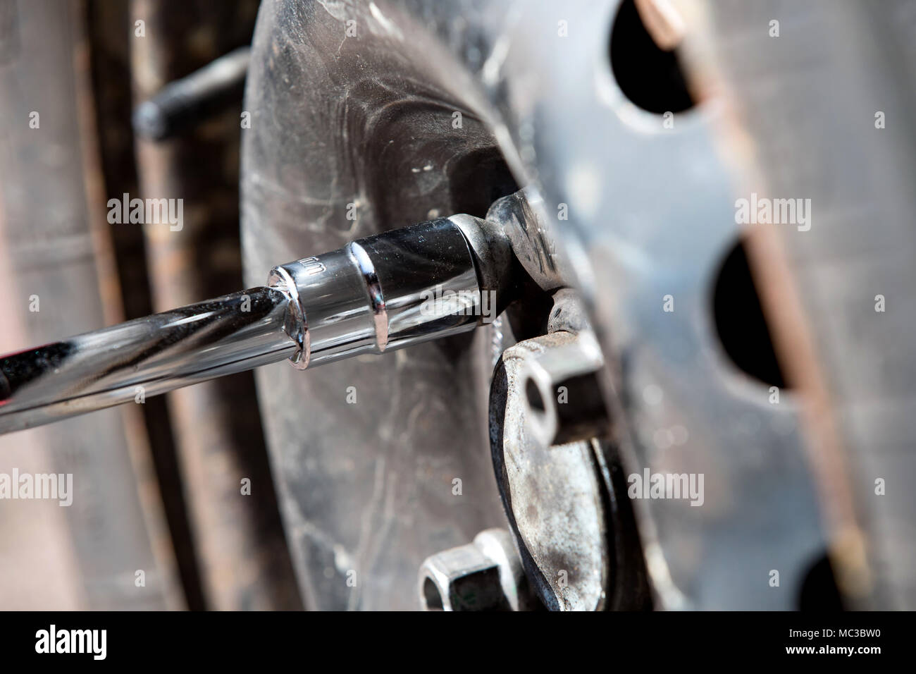 wheel change with torque wrench Stock Photo - Alamy