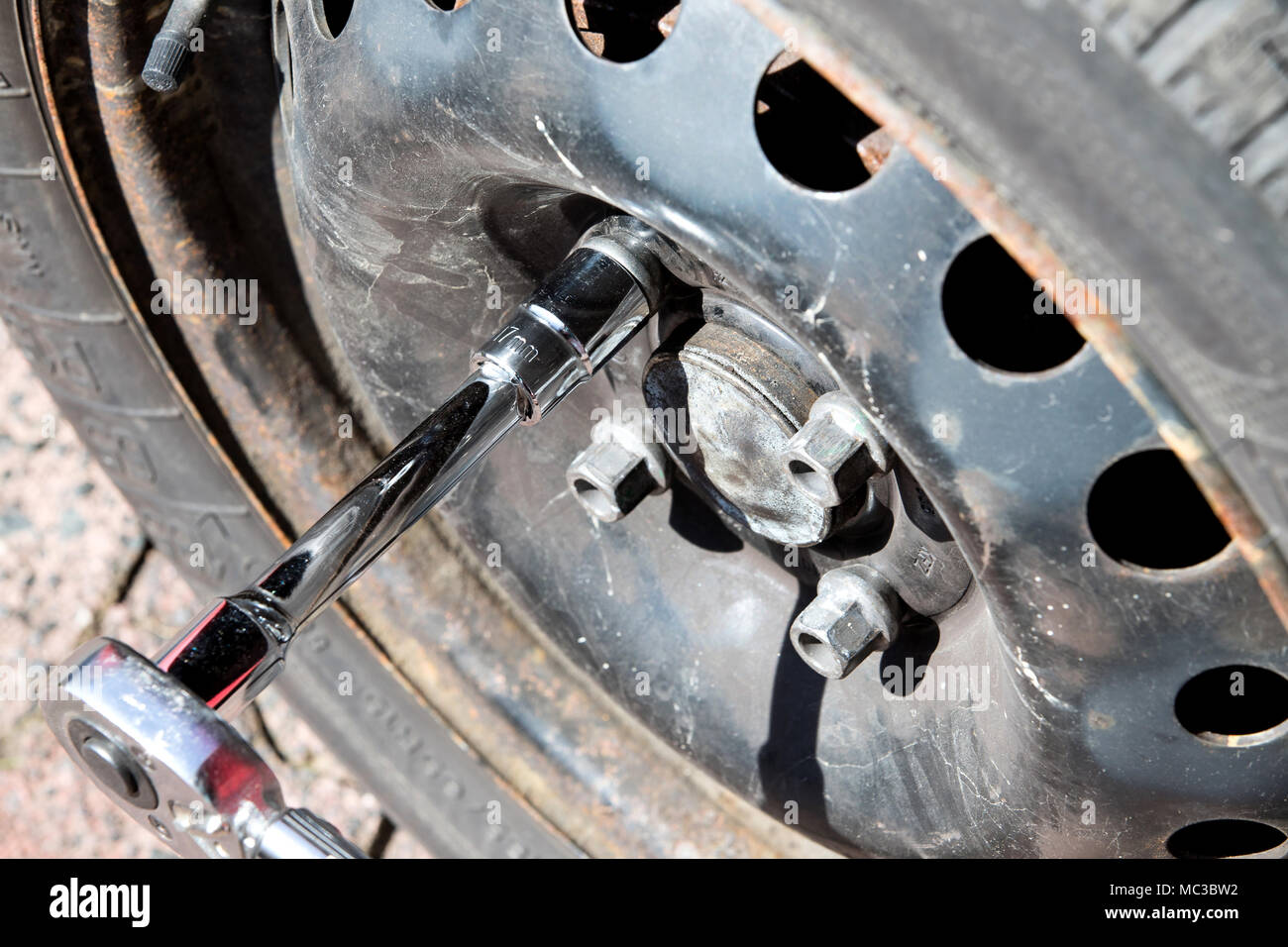 wheel change with torque wrench Stock Photo - Alamy