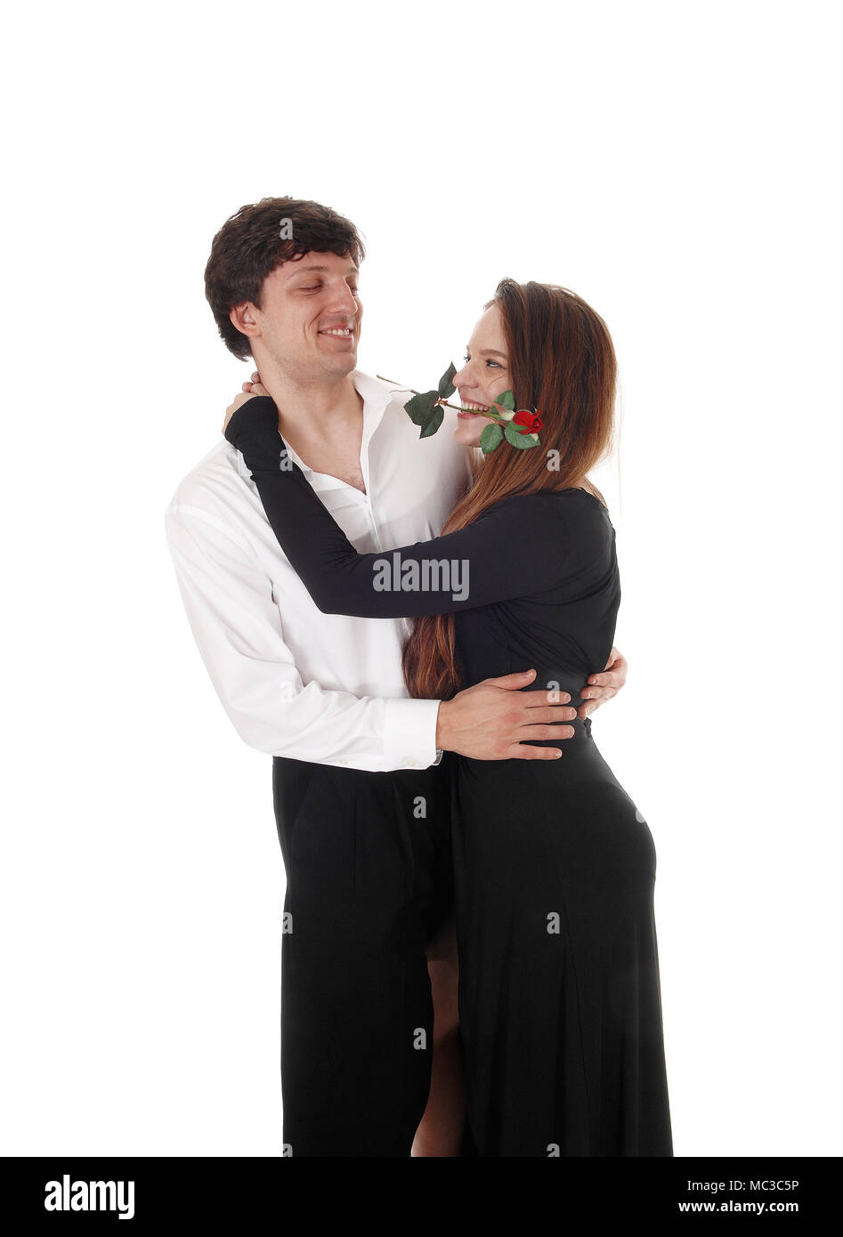 A beautiful young couple standing isolated for white background and ...