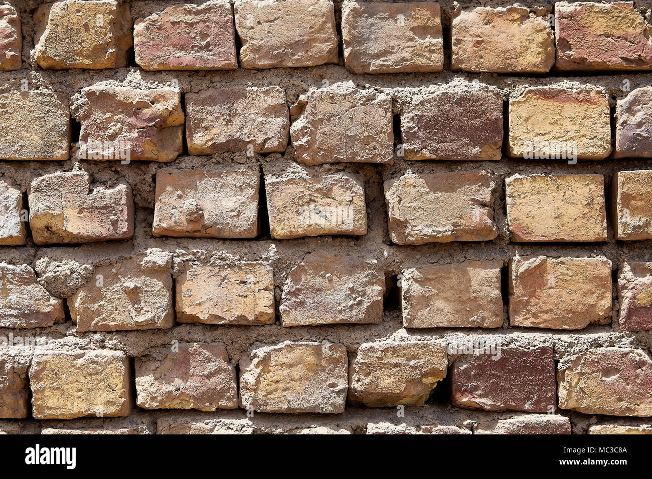 Decrepit brick wall with dried cement in the seams, background texture ...
