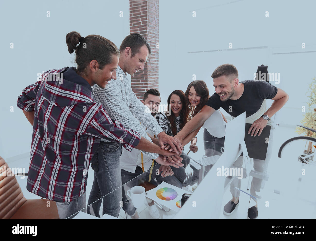 team of designers shows their success Stock Photo - Alamy