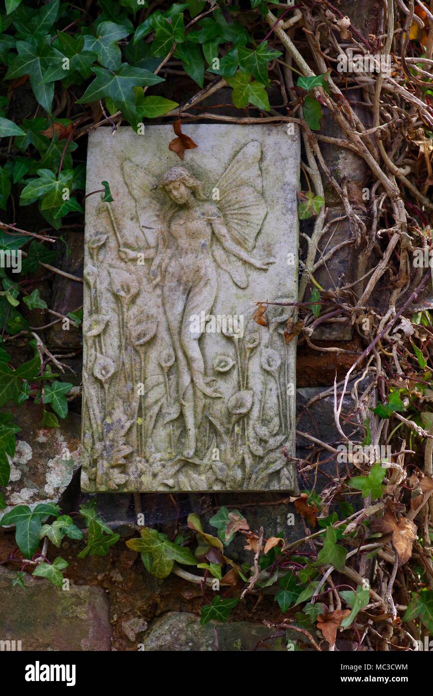 Porcelain Plaque of a Garden Fairy on an Ivy Covered Gate Post ...