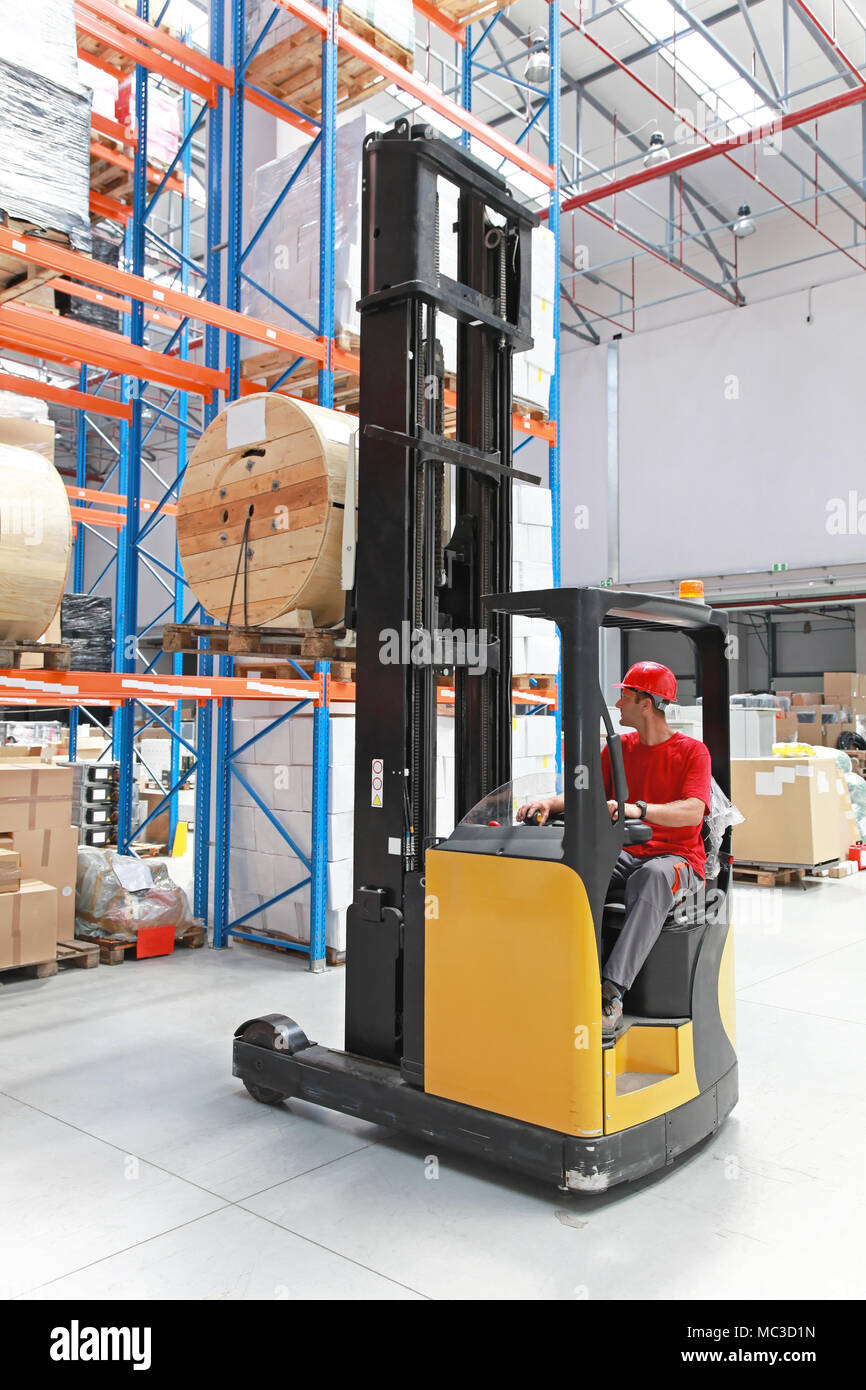 Forklift Loading Pallet With Spool in Distribution Warehouse Stock ...
