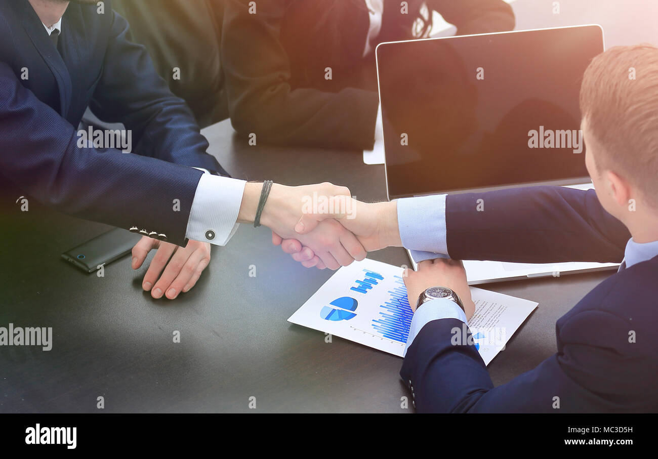 concept of cooperation and partnership. handshake financial partners ...