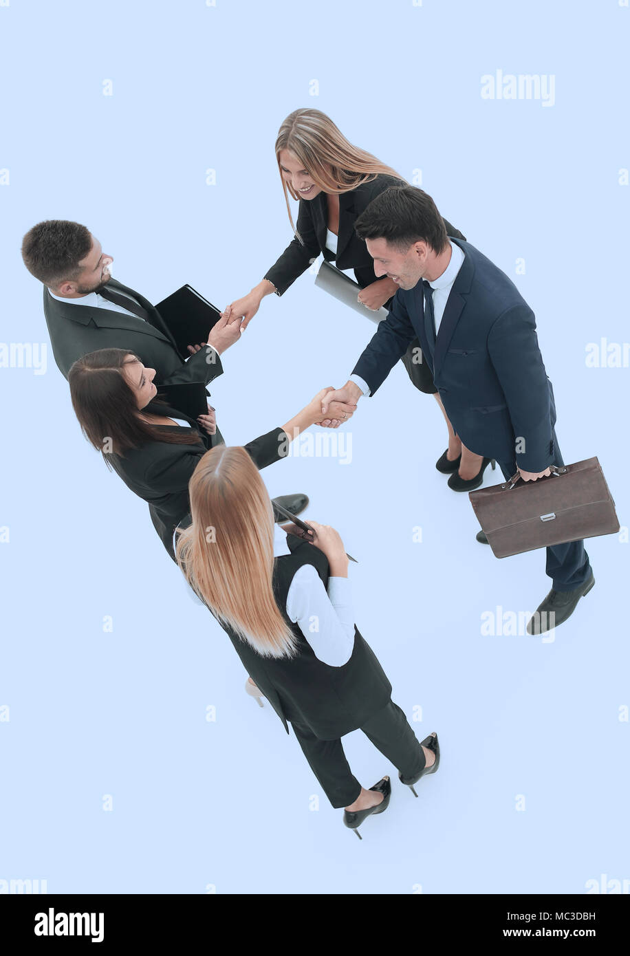 view from the top.the handshake business partners. On a white ...