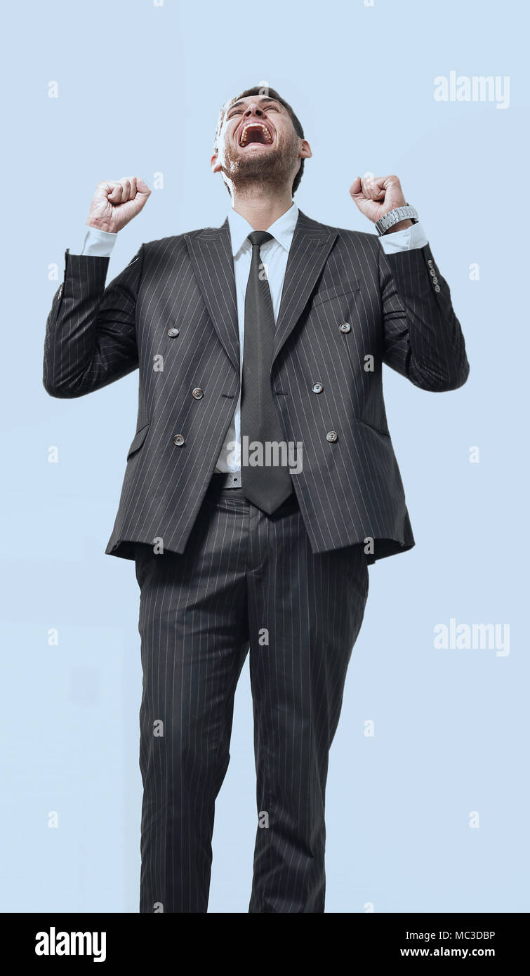 in full growth. portrait, triumphant businessman ,isolated on white ...