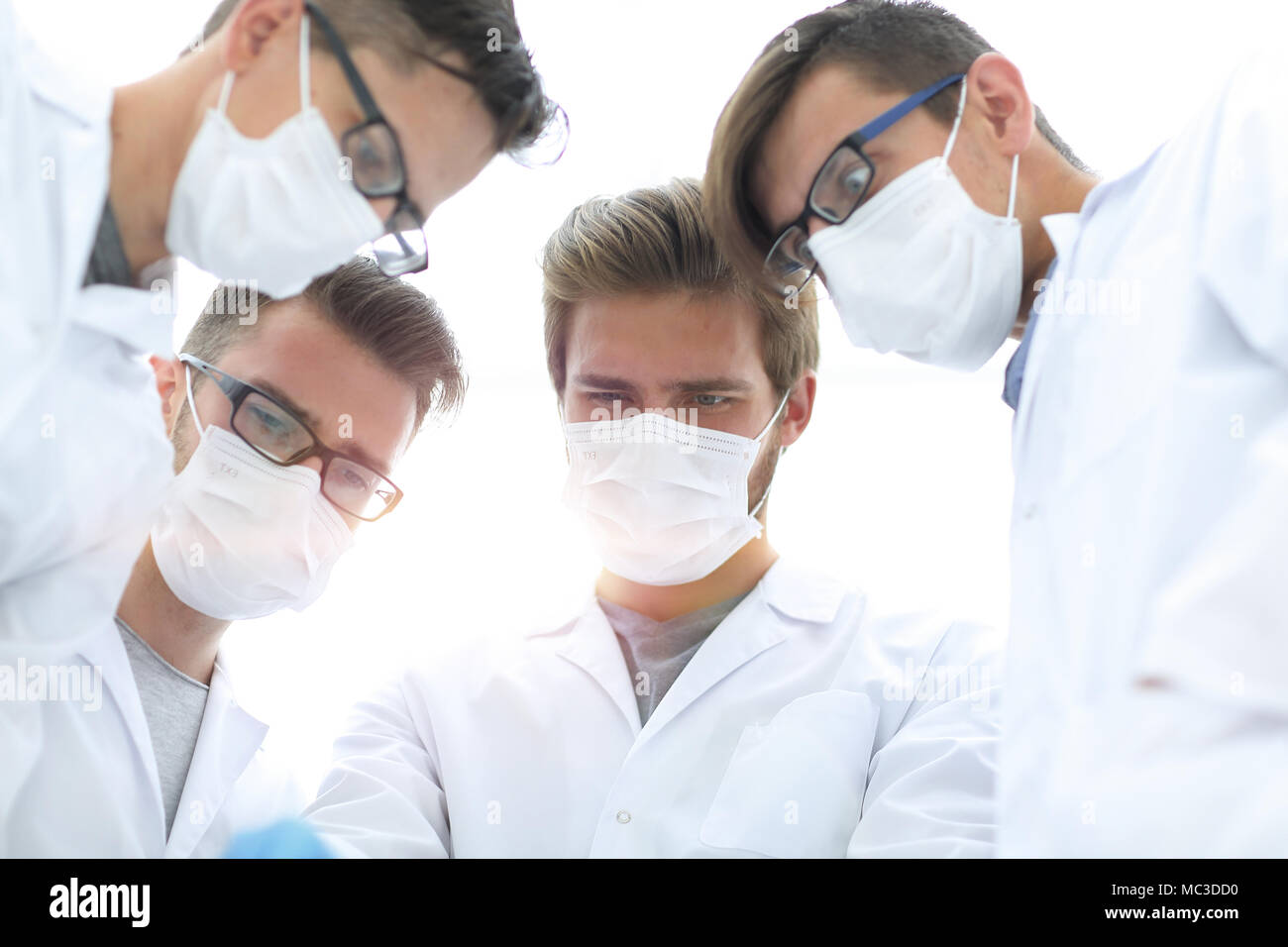 closeup.the surgical team in the operating room.the concept of teamwork ...