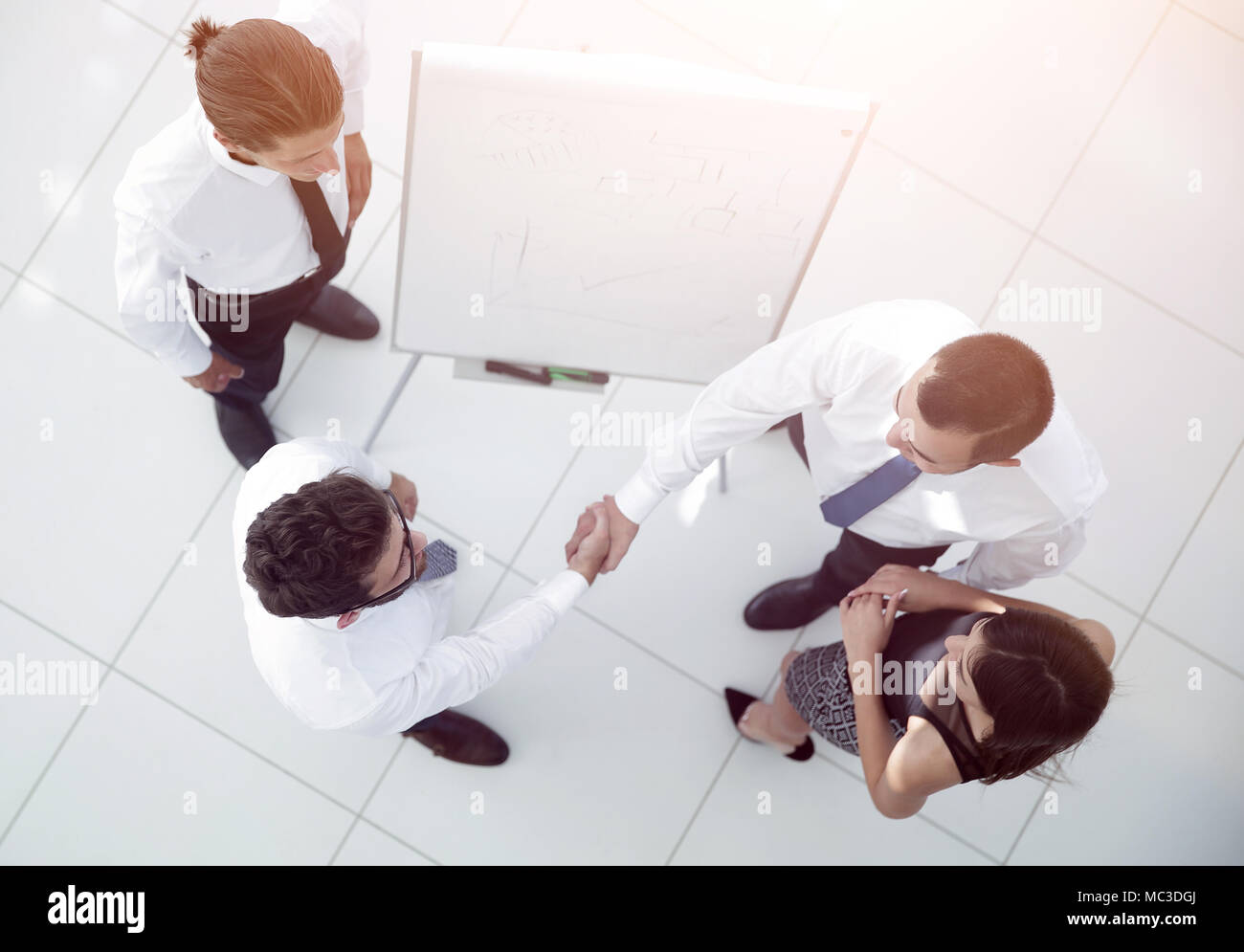 view from the top. background image of handshake of business partners ...