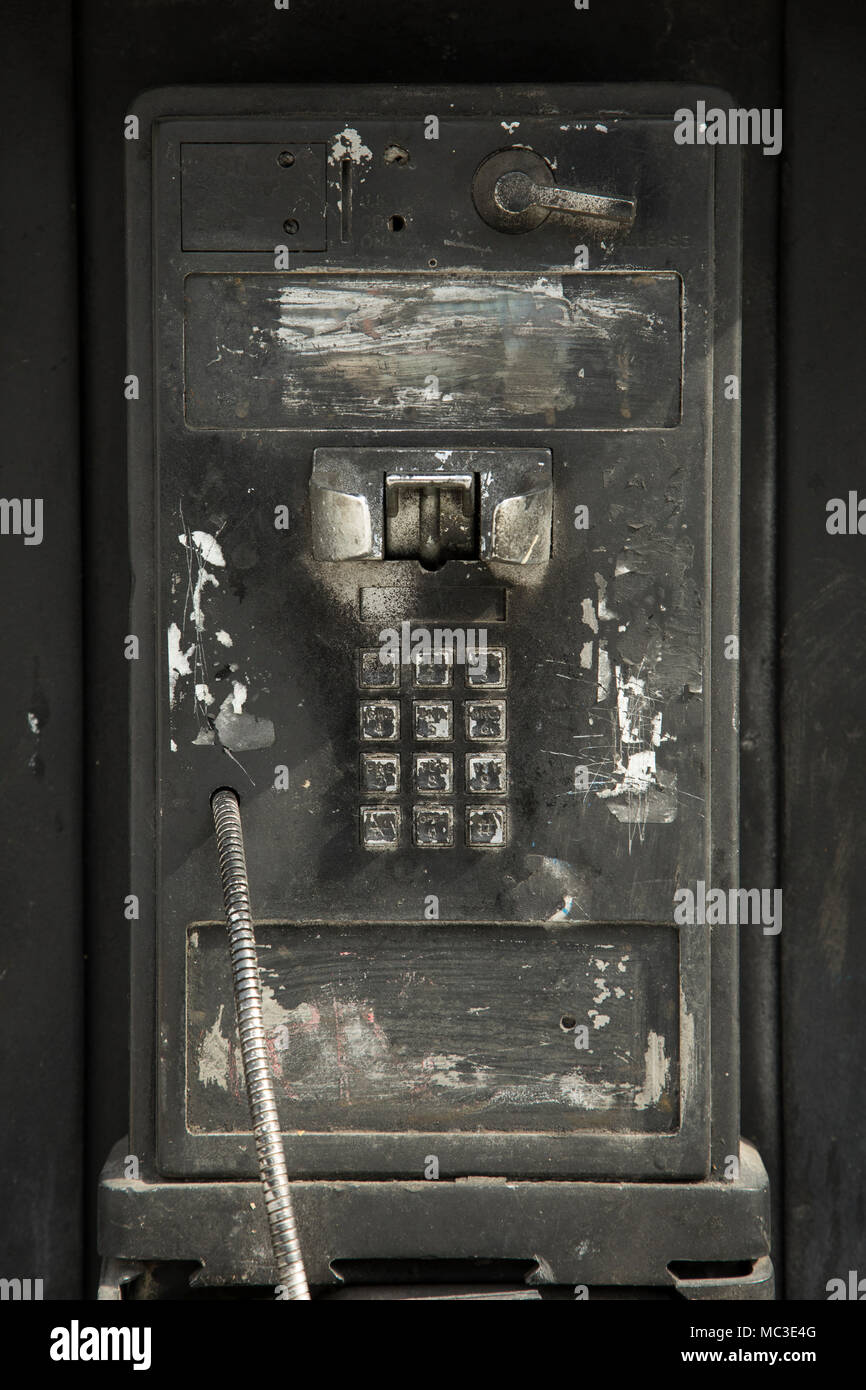Old public telephone in disrepair, downtown Los Angeles, California ...