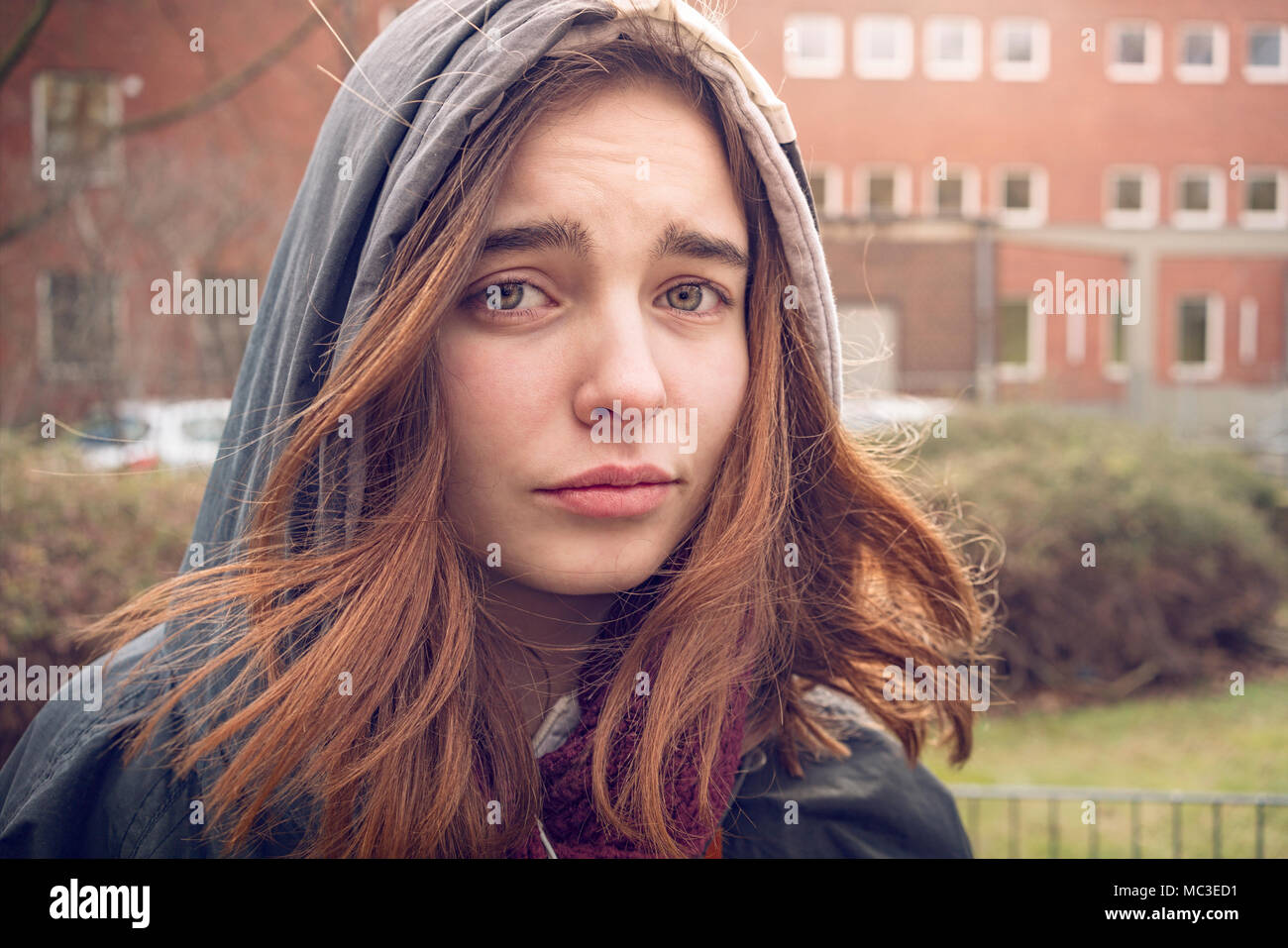 portrait of a doubting young woman Stock Photo - Alamy