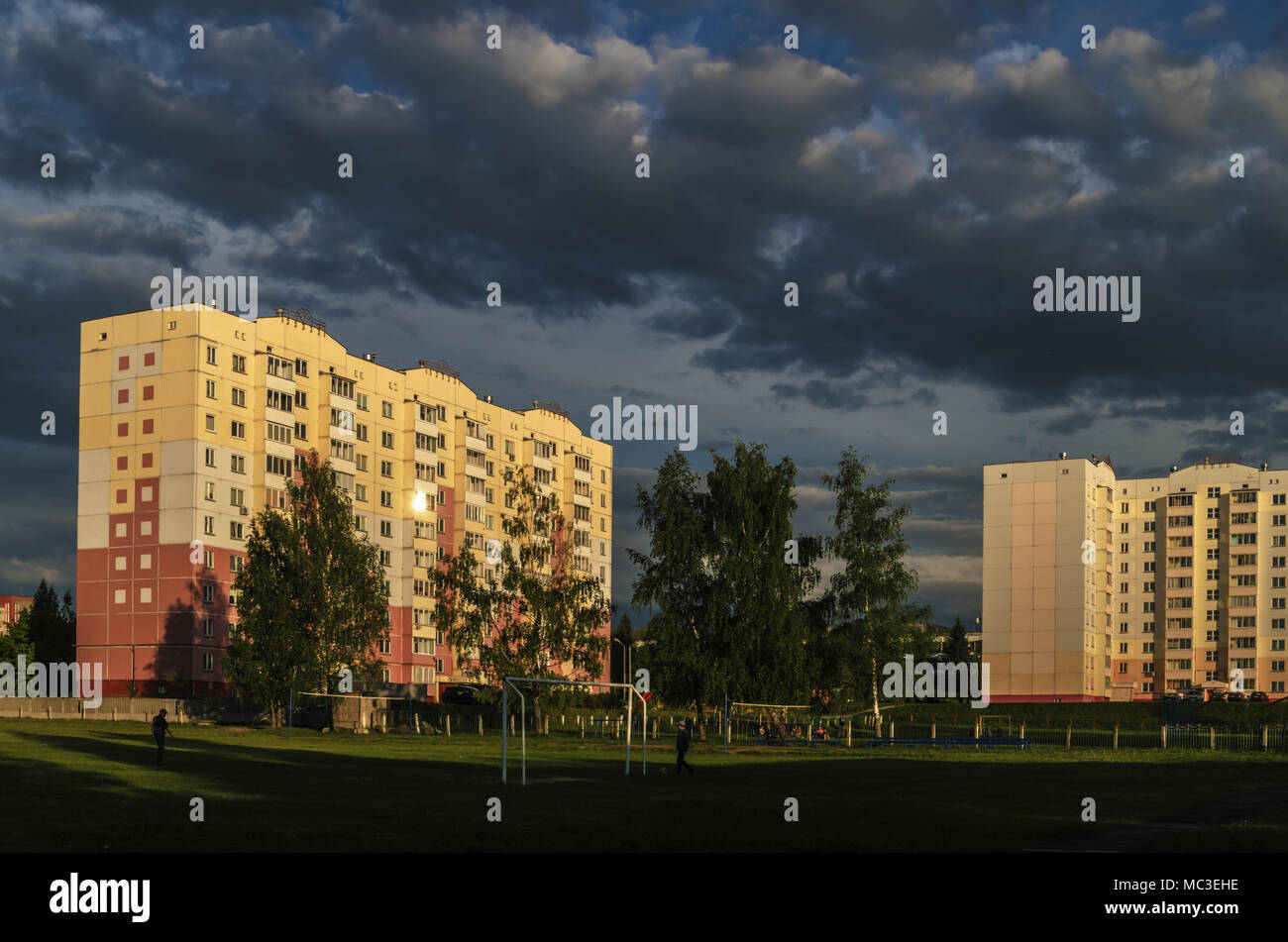 Evening sky over city buildings Stock Photo - Alamy
