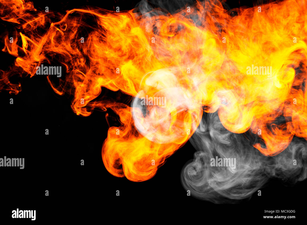 Fire flames background. Dense fiery smoke on a black isolated ...