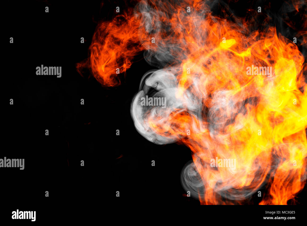 Fire flames background. Cloud of fiery smoke on a black isolated ...