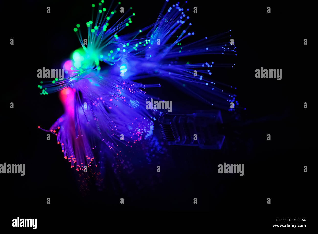 Optical fibre cable against black background Stock Photo - Alamy