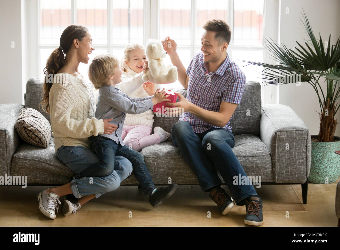 Happy family kids congratulating hi-res stock photography and images ...