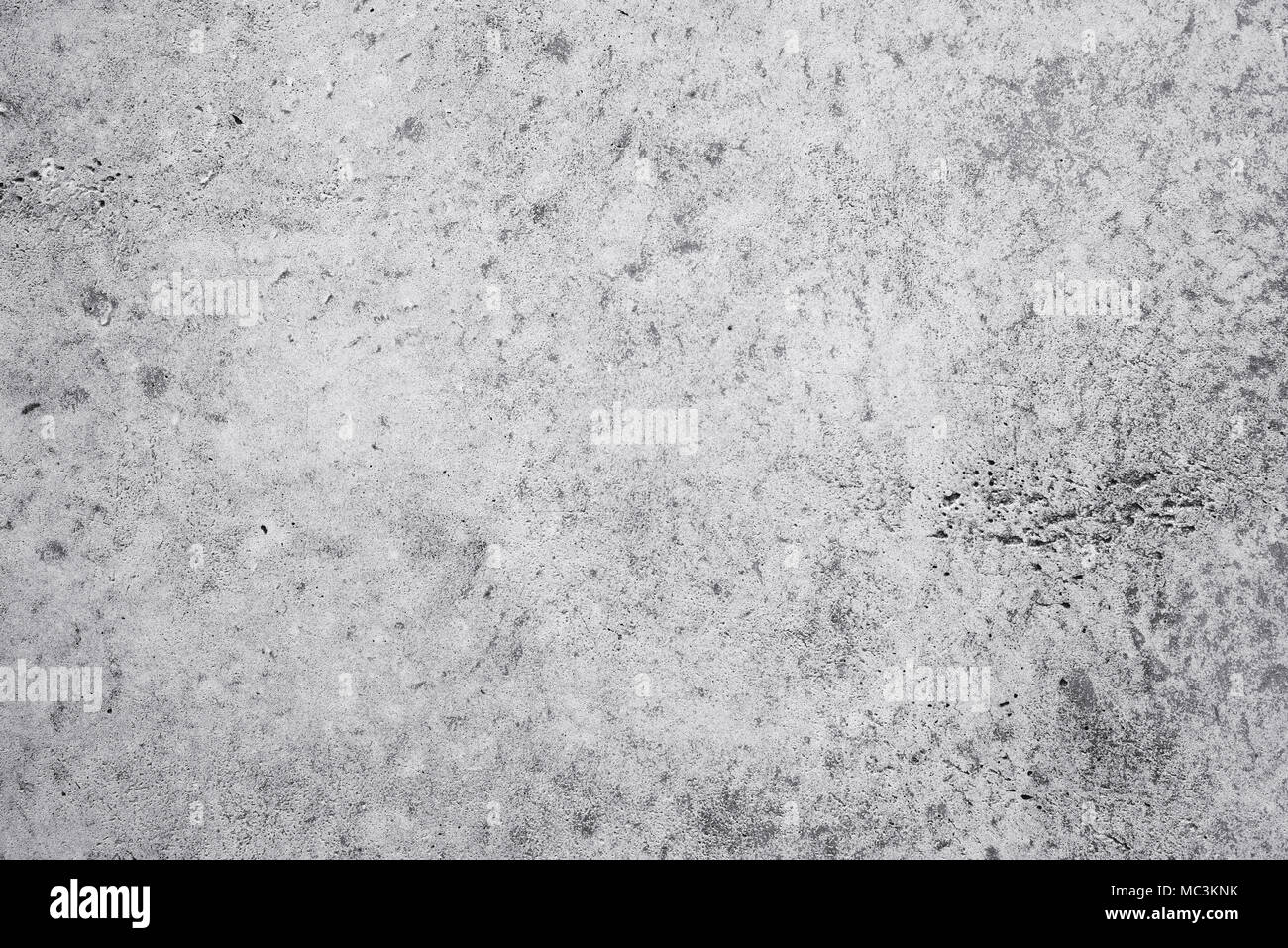 Abstract rough bright concrete surface texture with bugholes as ...