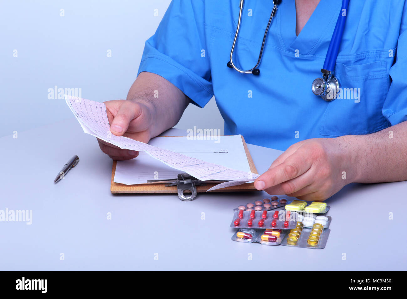 Close up doctors hands holding pen hi-res stock photography and images ...