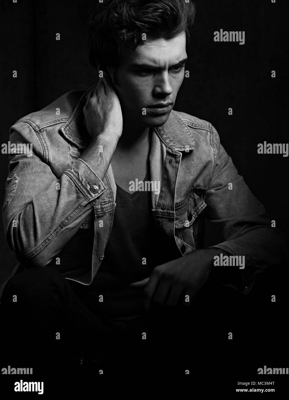 Handsome young man dramatic Black and White Stock Photos & Images - Alamy