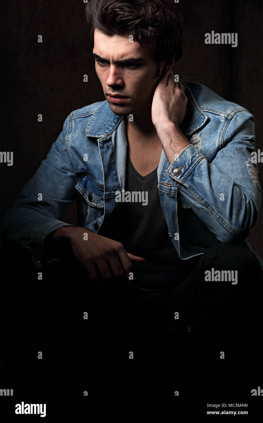 Thinking serious depression charismatic man looking down on dark shadow ...