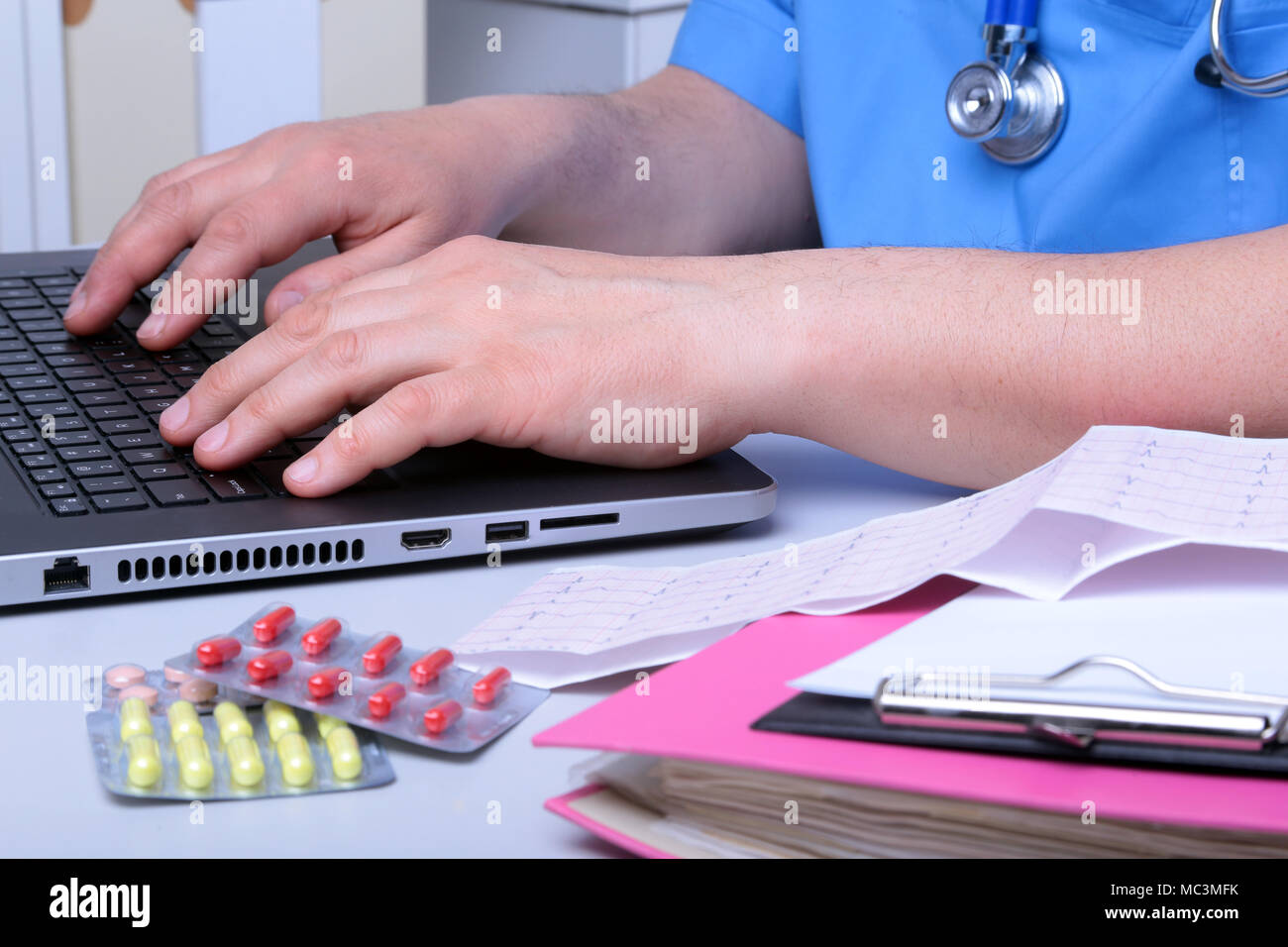 View of Details of doctor hands typing on keyboard Stock Photo - Alamy