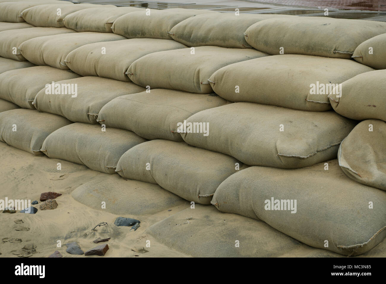 Tightly packed sand filled bags placed on the Durban beachfront to ...