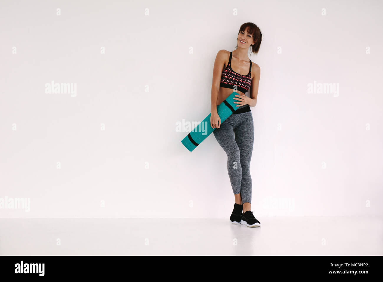 Female model leaning on wall hi-res stock photography and images - Alamy
