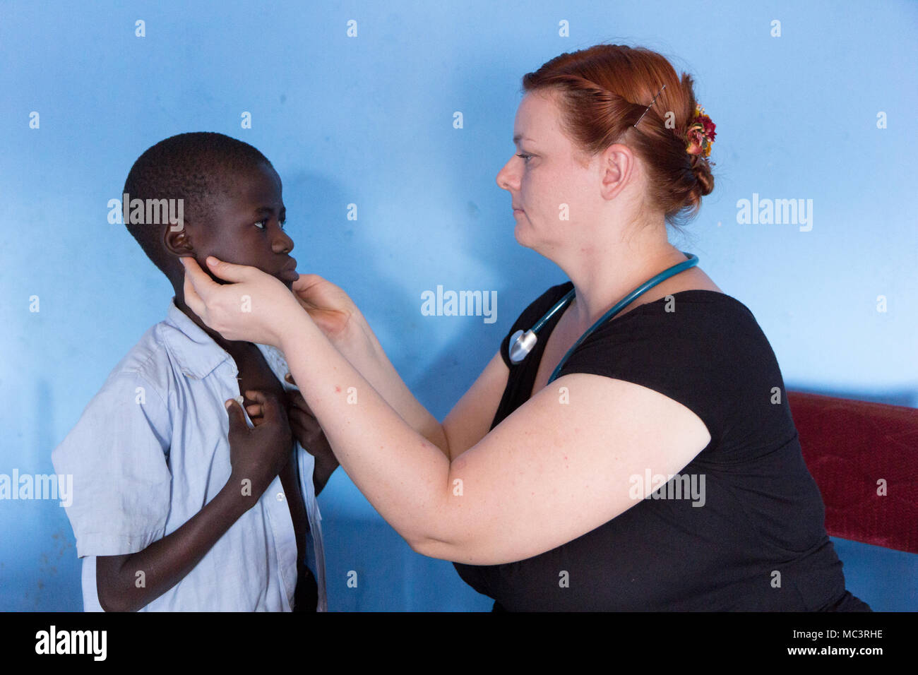 African doctor examining patient hi-res stock photography and images ...
