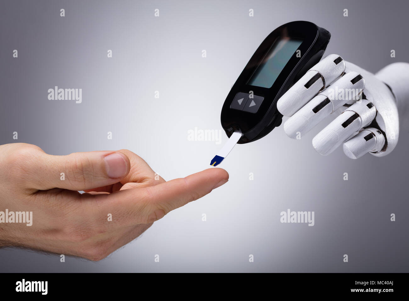 Close-up Of A Robot Hand Checking Person's Sugar Level With Glucometer ...