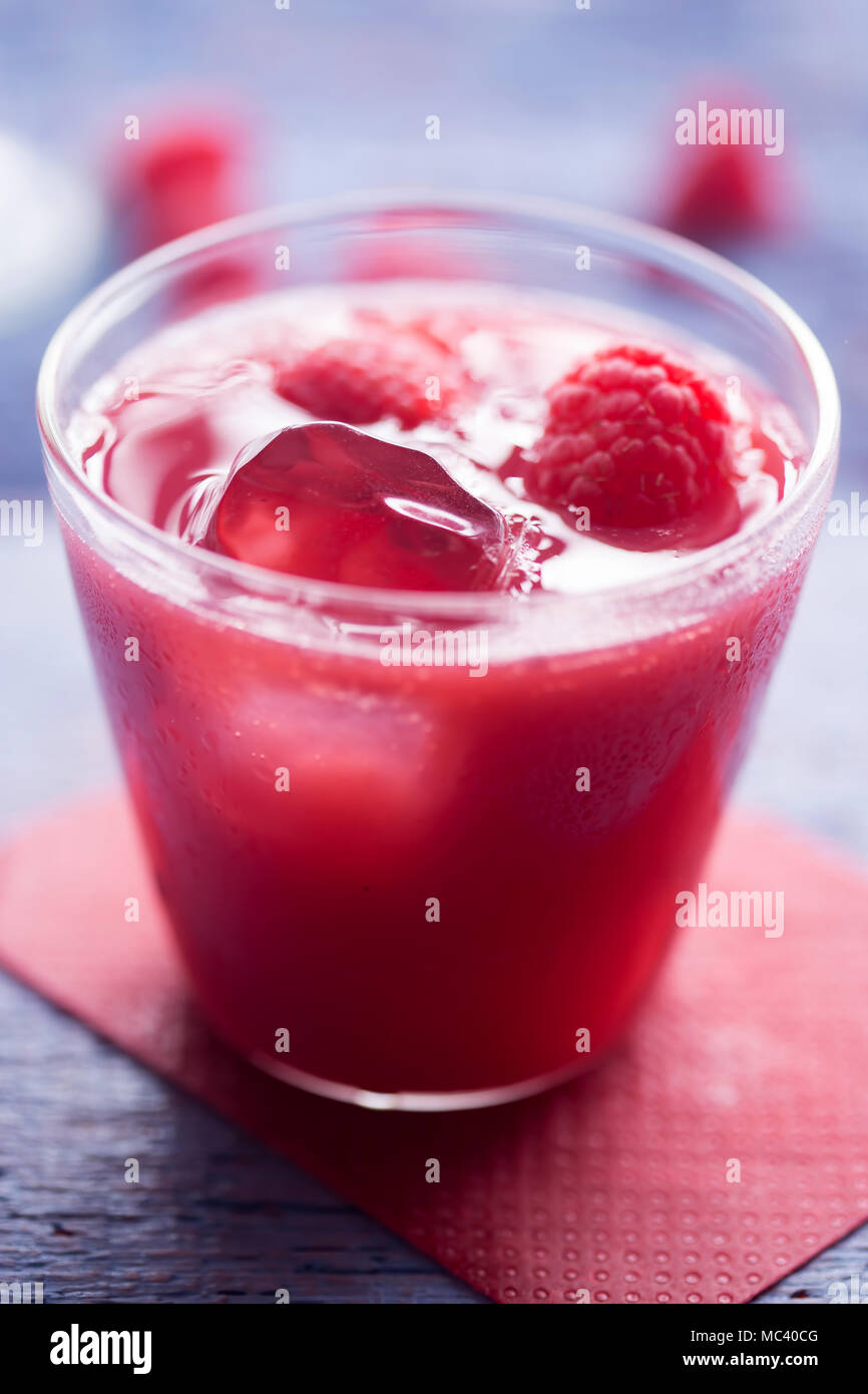 Summer berry juice with ice and raspberries Stock Photo - Alamy