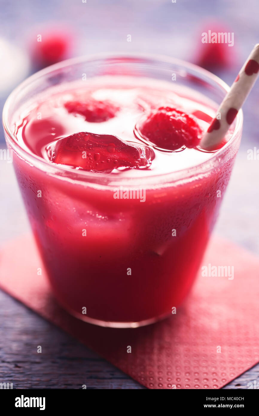 Summer berry juice with ice and raspberries Stock Photo - Alamy