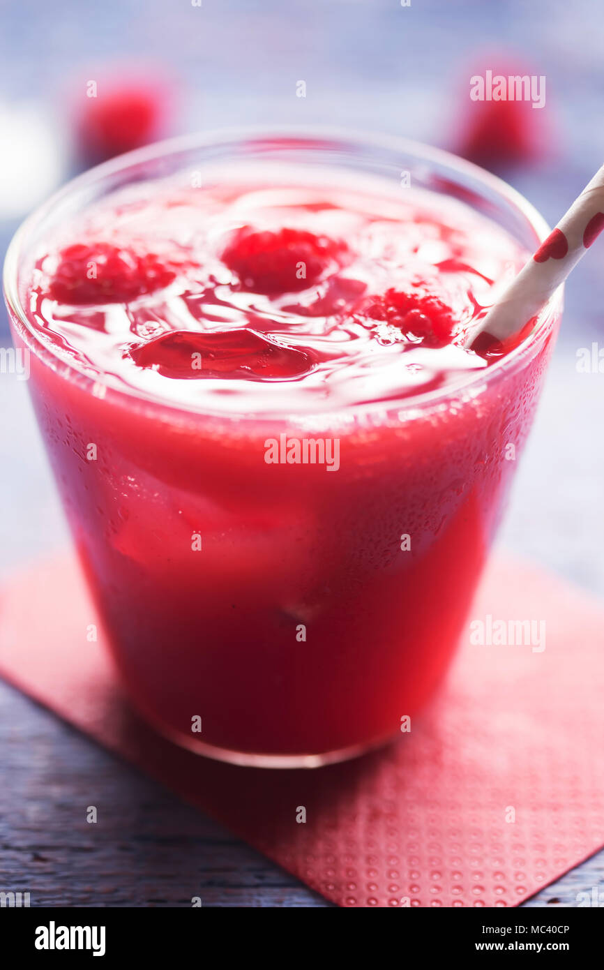 Summer berry juice with ice and raspberries Stock Photo - Alamy