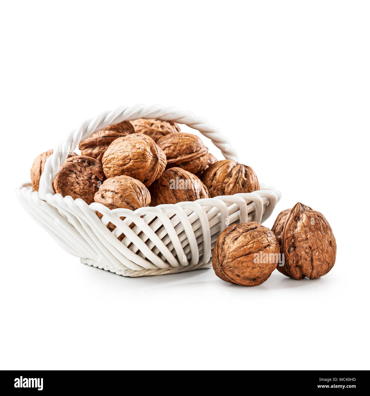Walnuts in porcelain basket, whole walnut heap as healthy eating and ...
