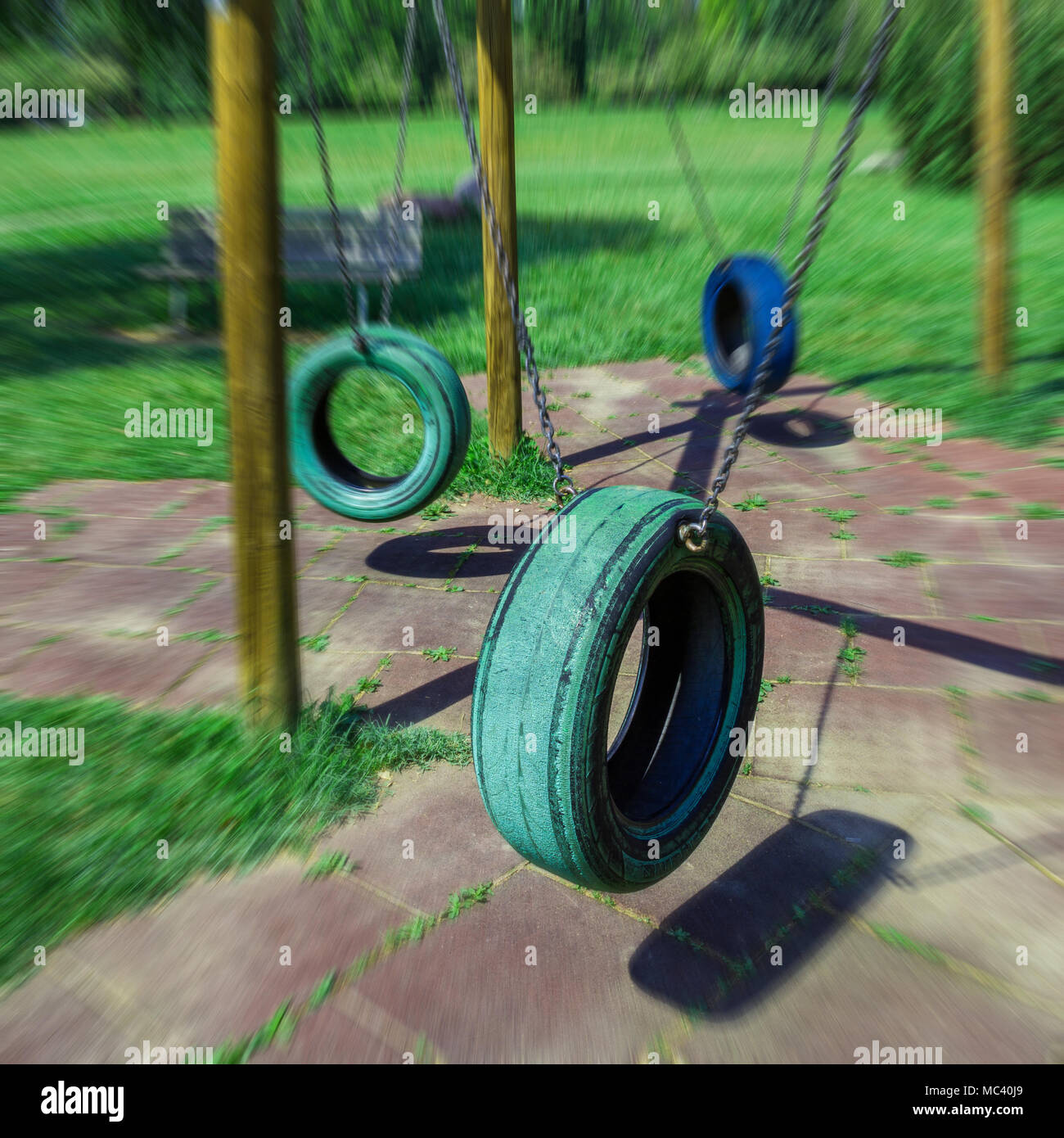Tire swing in park, background Stock Photo - Alamy