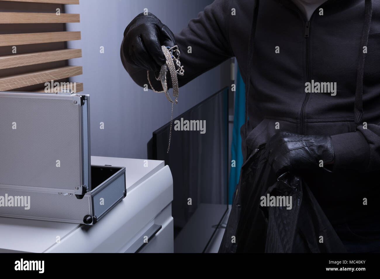 Burglar stealing jewelry hi-res stock photography and images - Alamy