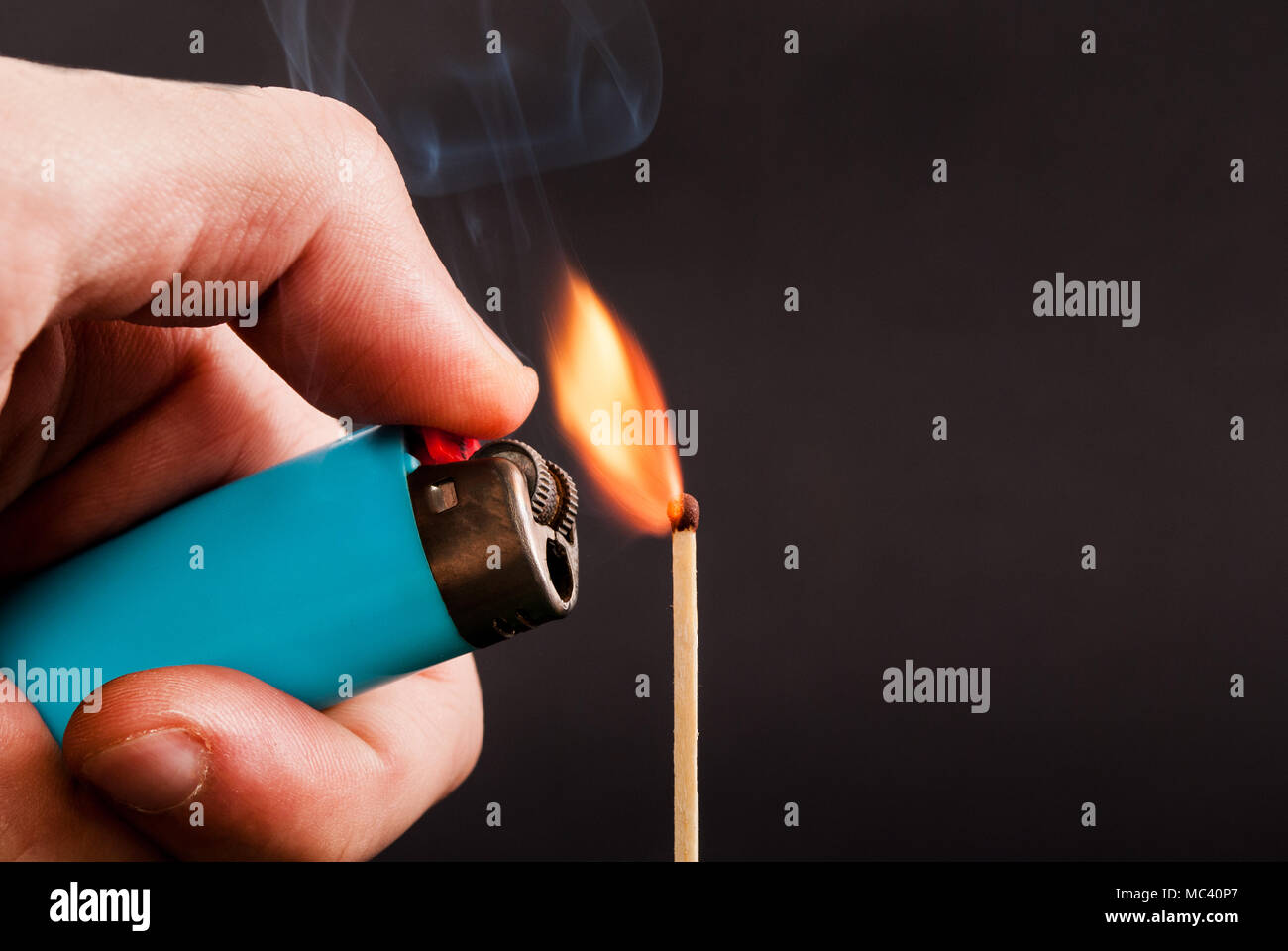 Hand holding lighter hi-res stock photography and images - Alamy
