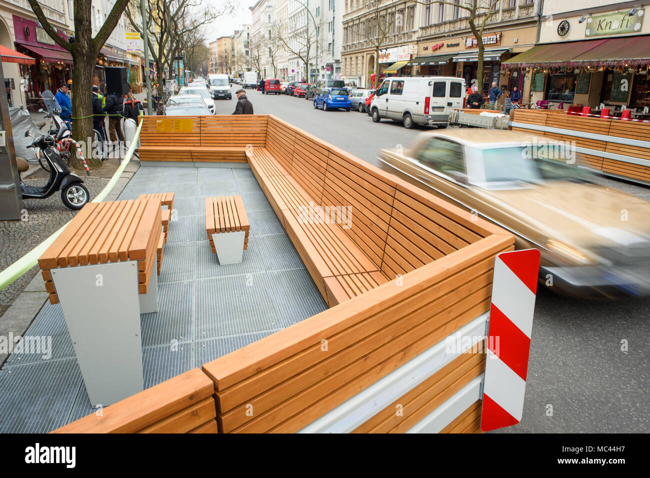 15 March 2018, Germany, Berlin: A car drives past so-called parklets ...