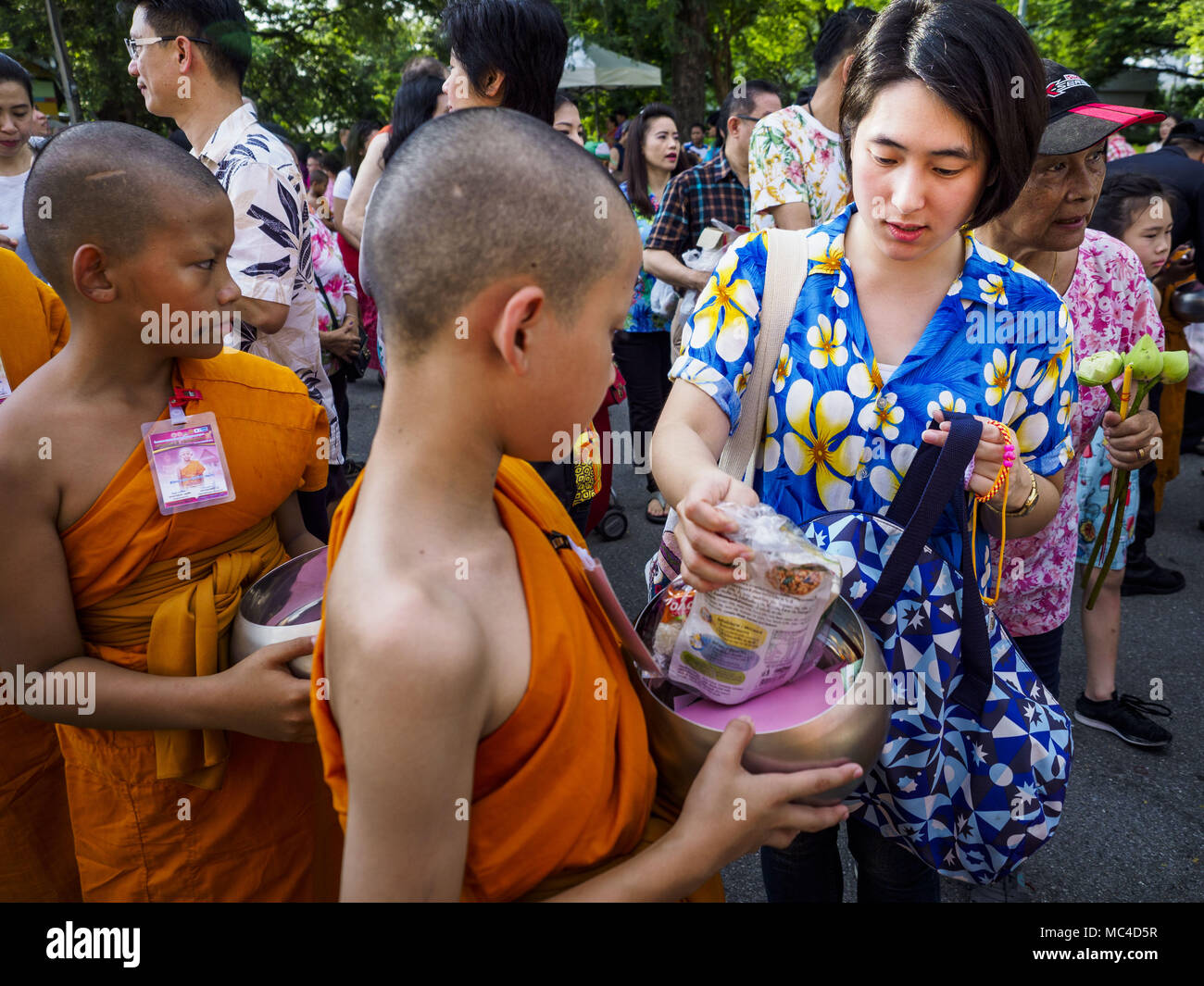 Bangkok, Bangkok, Thailand. 13th Apr, 2018. Buddhist novices collect ...