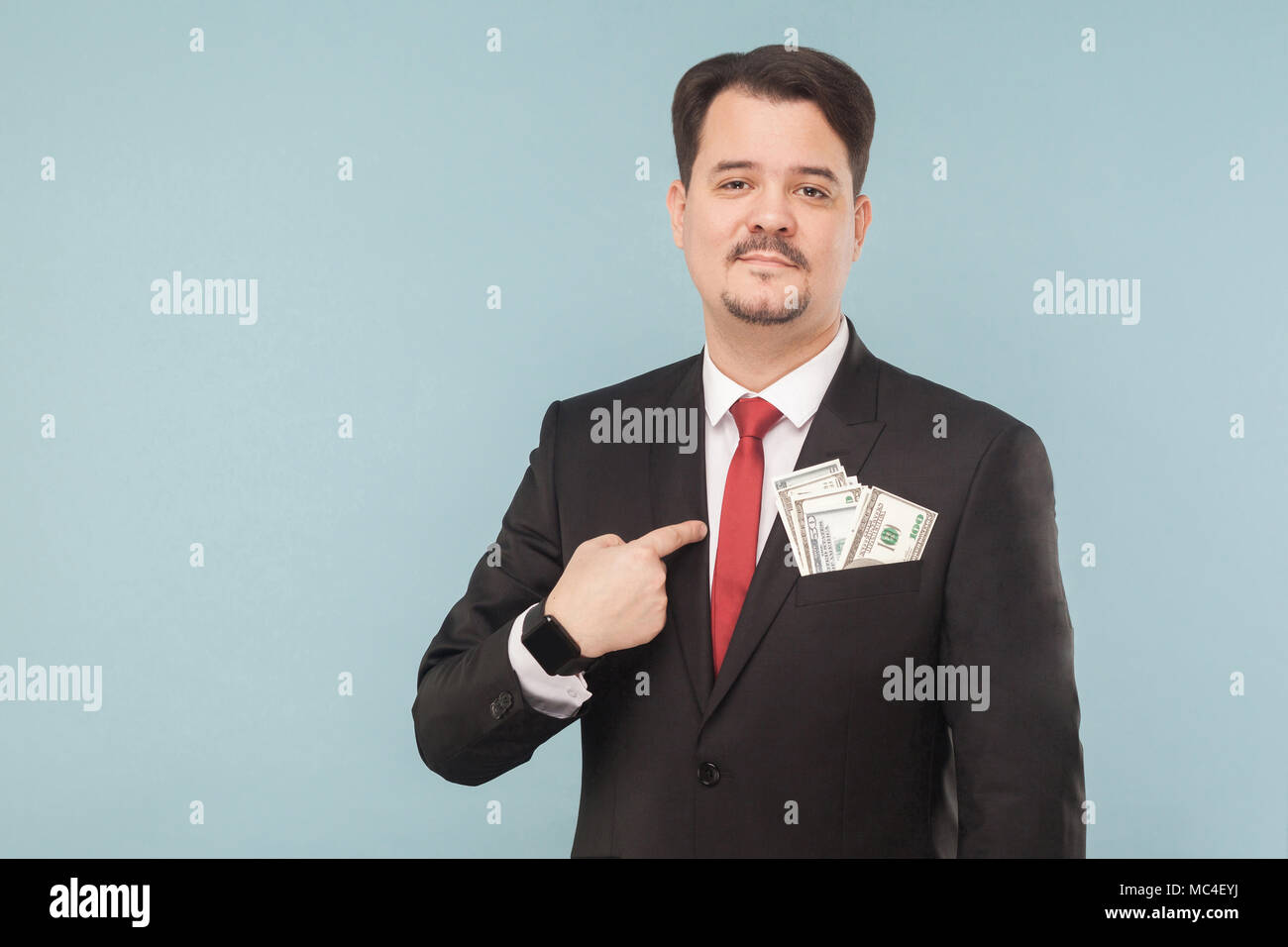 Businessman pointing finger at himself money in the pocket. Indoor ...