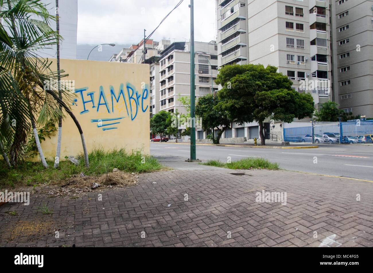 A graffiti with the word Hunger on a wall of a street in Caracas ...