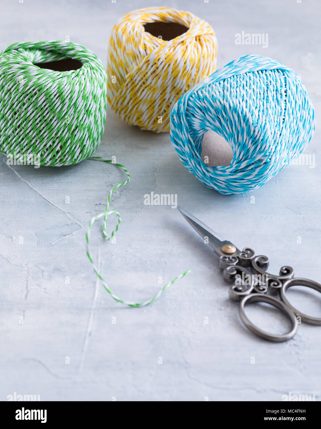 Colored cords with scissors, present wrapping and packing material ...