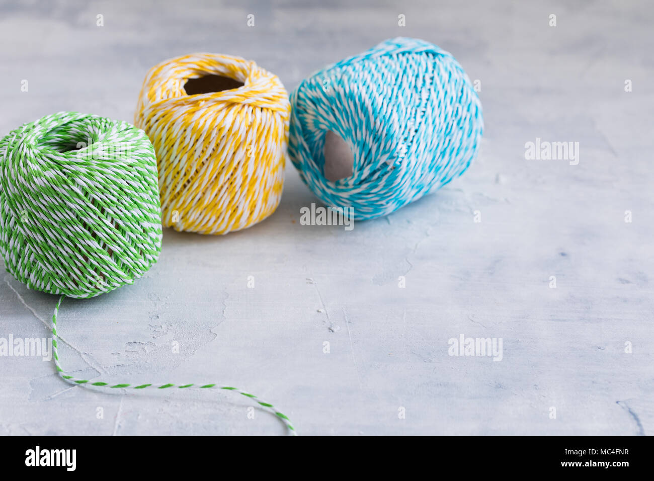 Colored cords with scissors, present wrapping and packing material ...