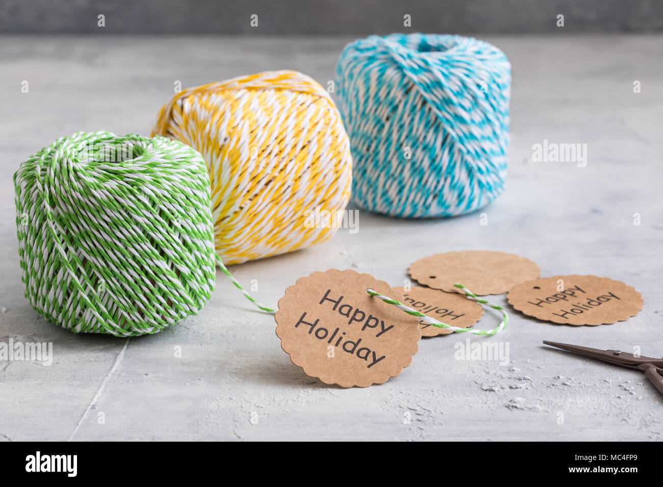 Colored cords with scissors, present wrapping and packing material ...