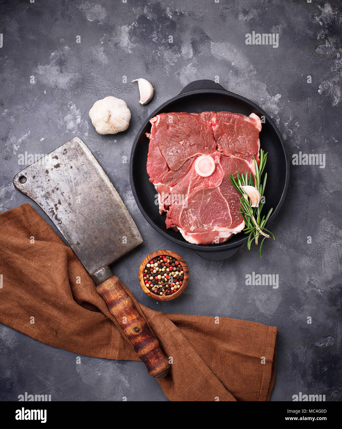 Lamb meat with rosemary, spices and cleaver Stock Photo - Alamy